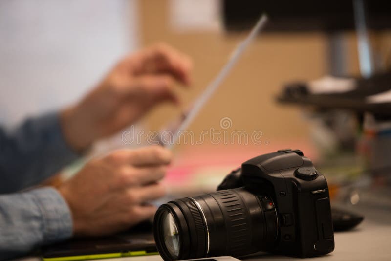Camera on Desk by Photographer in Creative Office Stock Image - Image ...
