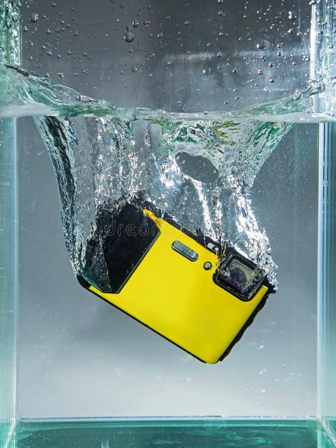 Camera Dropped in Container Water with Splash Stock Photo - Image of ...