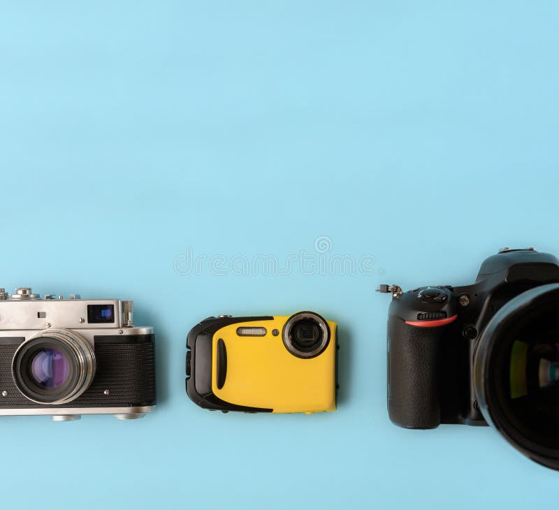 Camera Evolution.Cameras of Different Types and Generations on a Blue ...