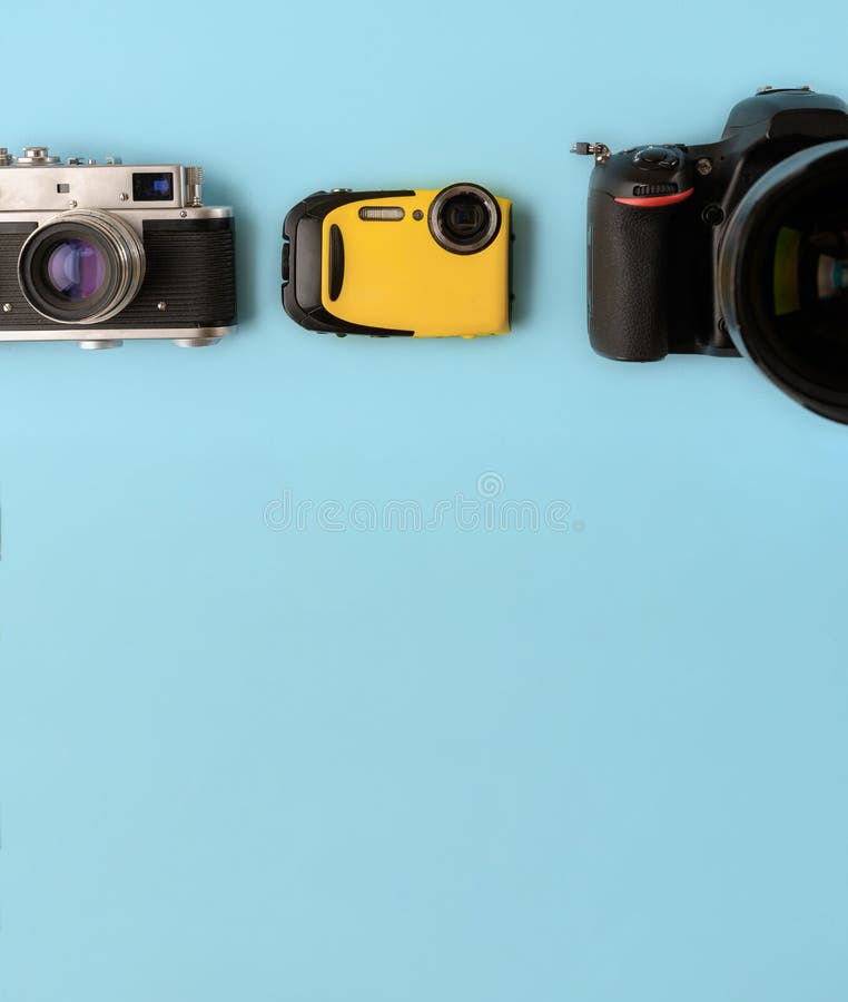 Camera Evolution.Cameras of Different Types and Generations on a Blue ...