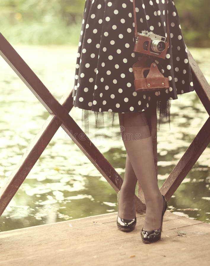 Camera and female legs stock photo. Image of retrostyle - 95361500