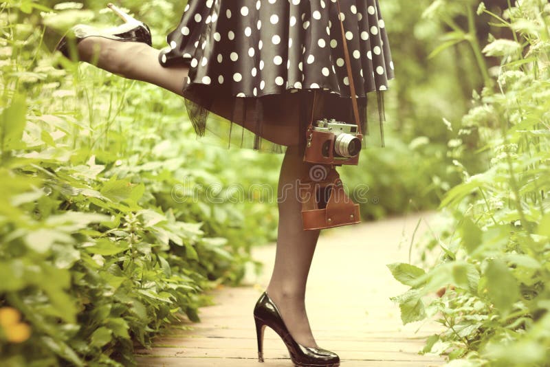 Camera and female legs stock photo. Image of enthusiasm - 95361692