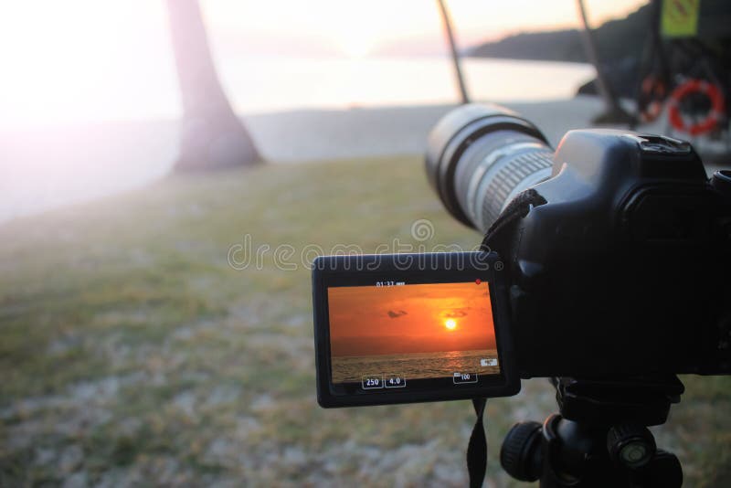 The Camera with Flip Screen while Recording a Video View of the Sunrise ...