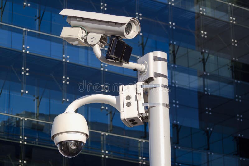 Camera in Front of a Glass Building Stock Image - Image of look, city ...
