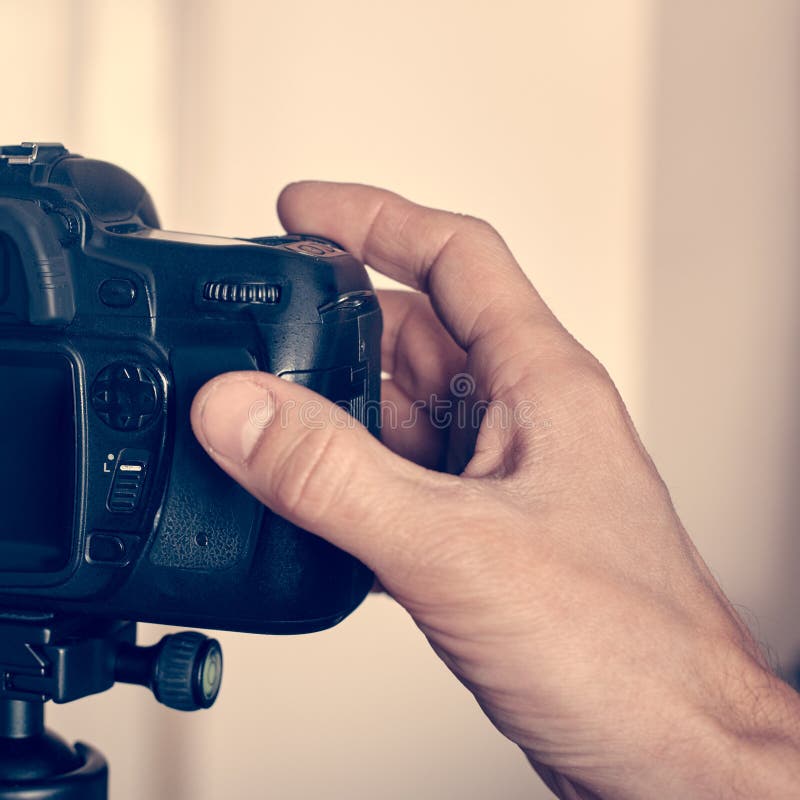 Camera with hand stock photo. Image of photosession - 108741534