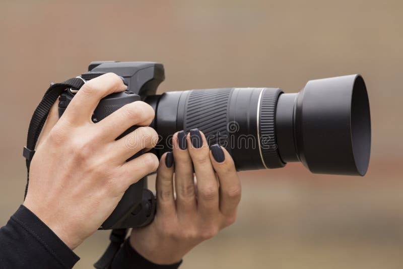 Camera in the Hands of Girls Stock Image - Image of macro, illuminated ...