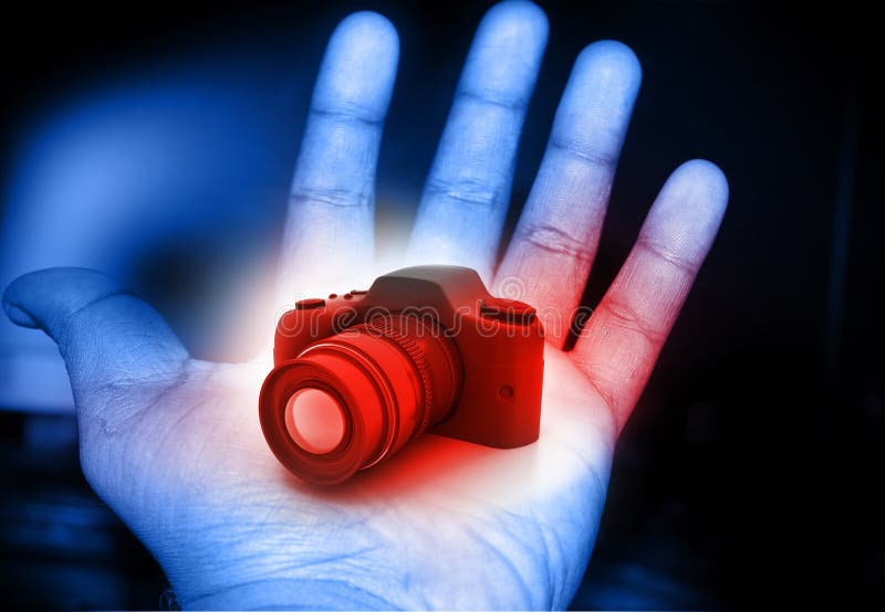 Camera in human hand stock photo. Image of technology - 50775036