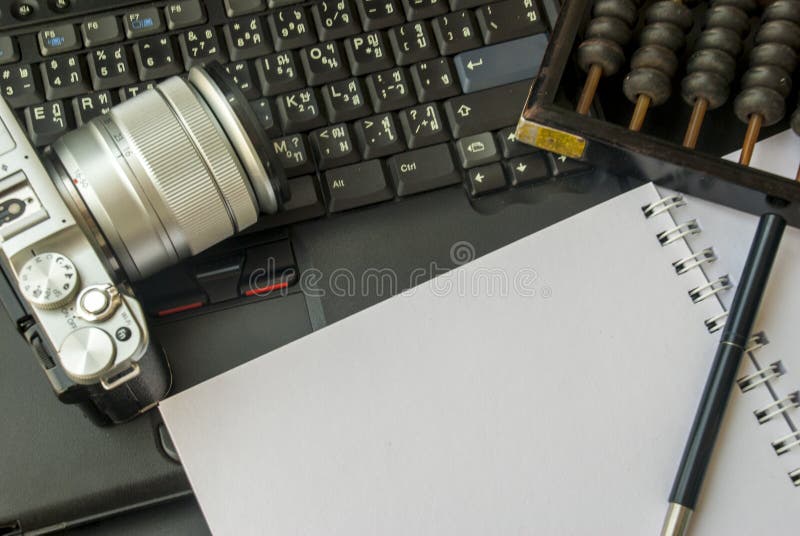 Laptop, Notebook, Abacus and Camera Placed on the Table Stock Photo ...