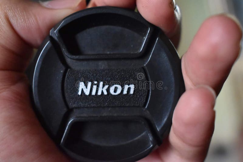 Camera lens cap editorial image. Image of hand, camera - 228322720