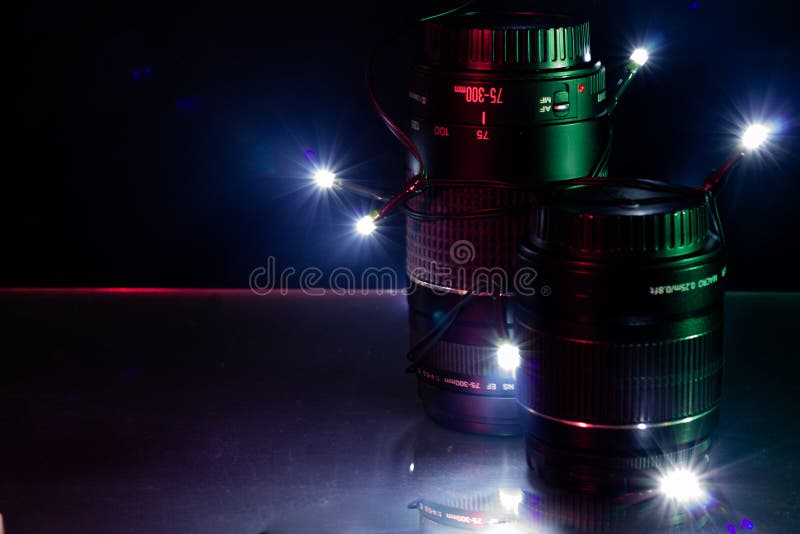 Camera Lens Display with Green and Blue Lights Editorial Photography ...