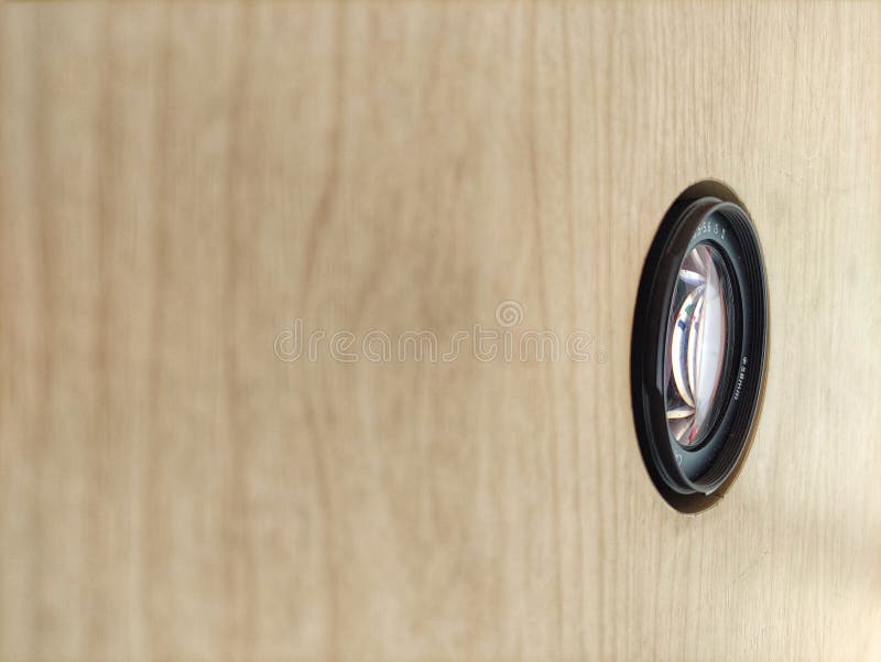 Camera Lens Embedded in a Smooth Wooden Surface. Stock Photo - Image of ...
