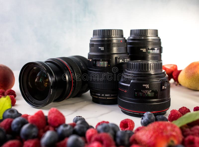 Camera Lens with Fruit and Food on White Table Stock Photo - Image of ...