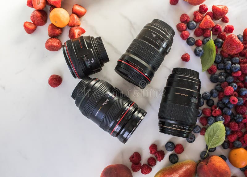 Camera Lens with Fruit and Food on White Table Stock Image - Image of ...