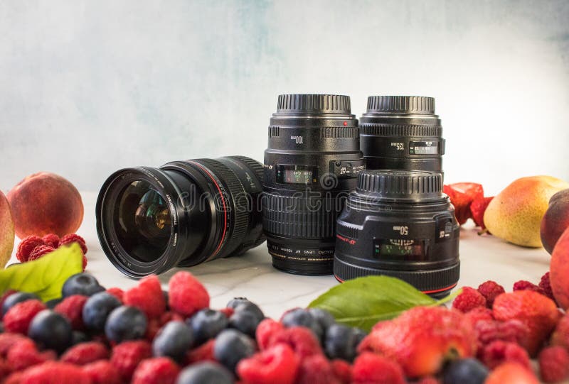 Camera Lens with Fruit and Food on White Table Stock Photo - Image of ...