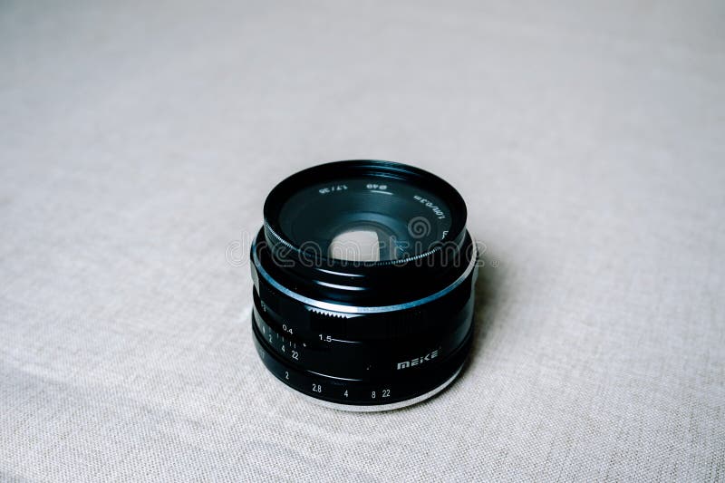 Camera Lens on Light-colored Fabric Surface in Studio Setting Stock ...