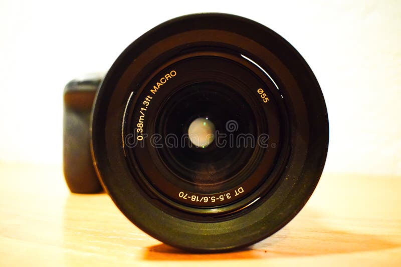 A Camera with a Lens on the Table Stock Photo - Image of circle ...