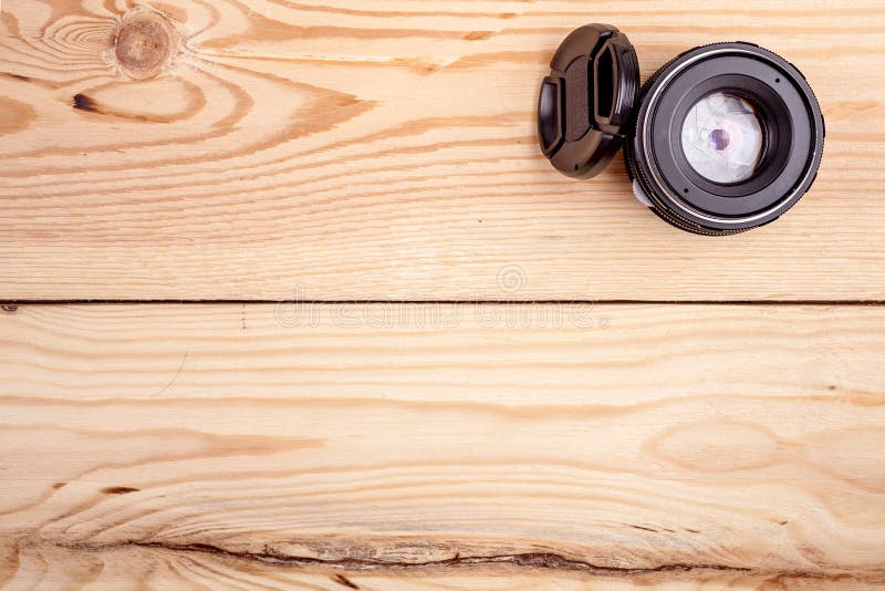 Camera Lenses on Wooden Table Top View. Background and Workspace for ...