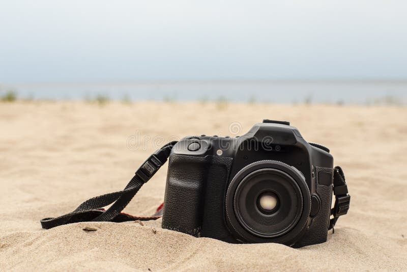 Camera Lying on the Sand on the Beach Stock Photo - Image of summer ...