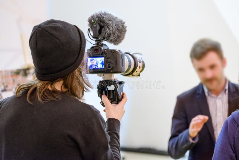 Camera Man Shoots an Interview Editorial Stock Photo - Image of people ...