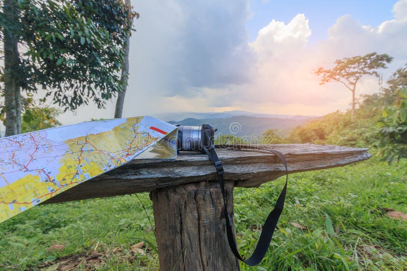 Camera and Map on Bench with Landscape Background Stock Image - Image ...