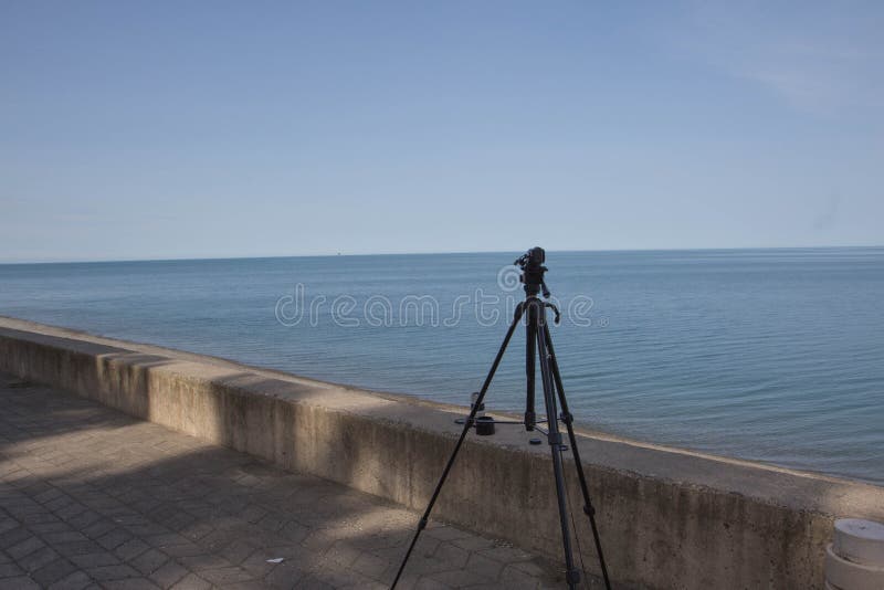 Camera Mounted on a Tripod Facing the Skyline of the Sea. a Panorama ...