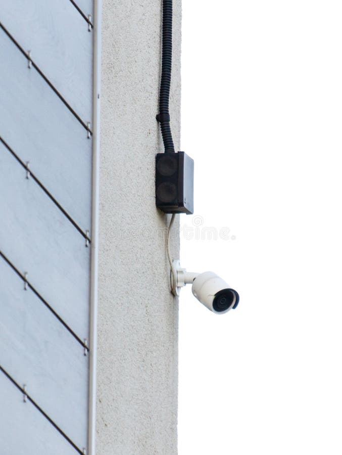 A Camera is Mounted on a Wall Next To a Power Box Stock Photo - Image ...