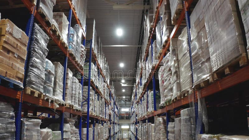 Camera Moving through Warehouse Aisles Showing Cardboard Boxes Stock ...