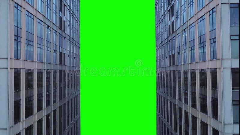 Camera Moving between Modern Skyscraper on Green Screen Background ...