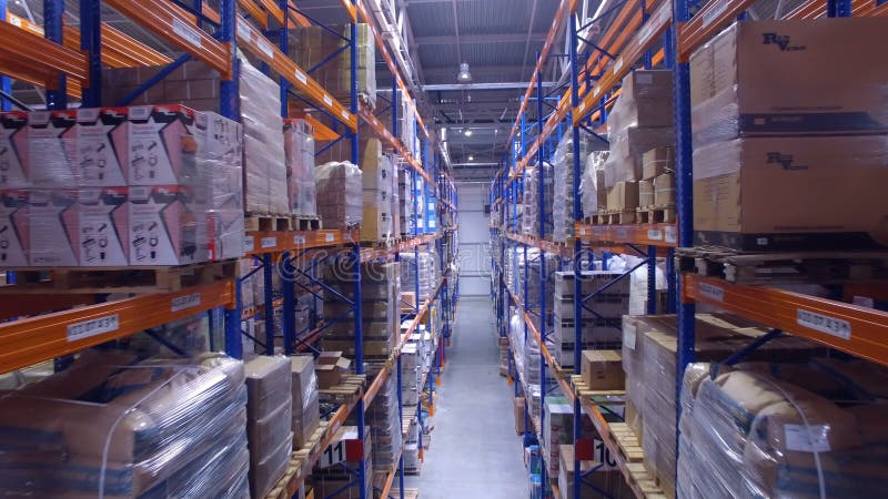 Camera Moving Straight between Warehouse Racking Rows. Stock Video ...