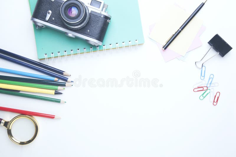 Camera with Notepad and Stationary on Table Stock Image - Image of desk ...