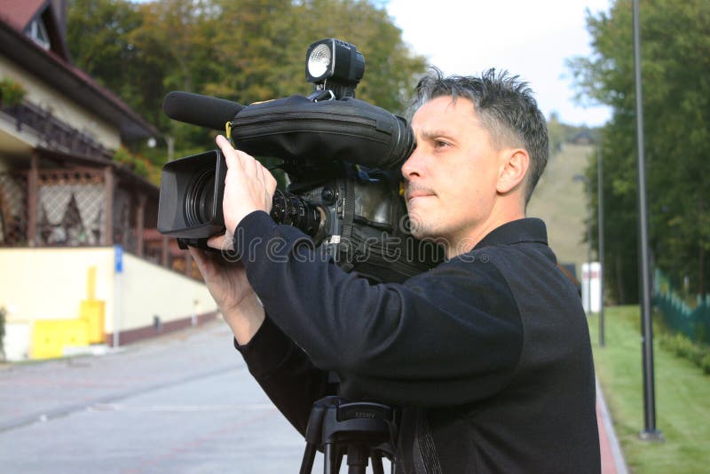 Camera Operator Working with a Cinema Broadcast TV Camera Stock Photo ...