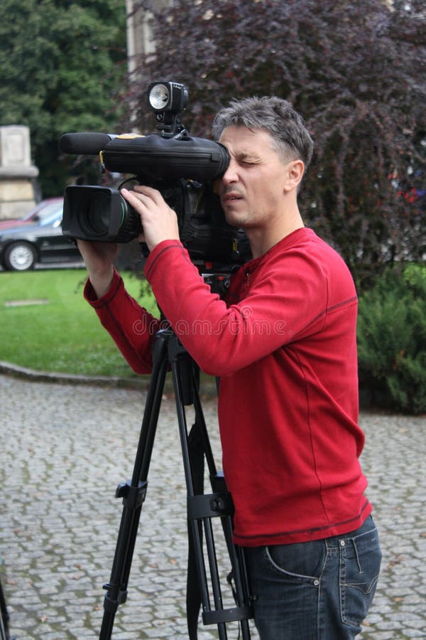 Camera Operator Working with a Cinema Broadcast TV Camera Stock Photo ...