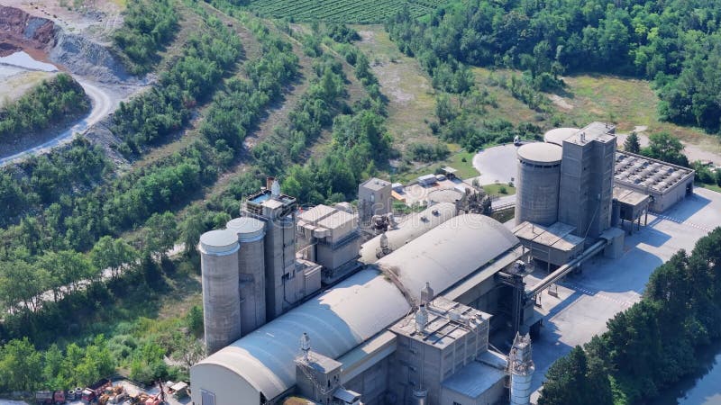 Camera Panning Over Cement Factory Complex Surrounded by Forest Stock ...