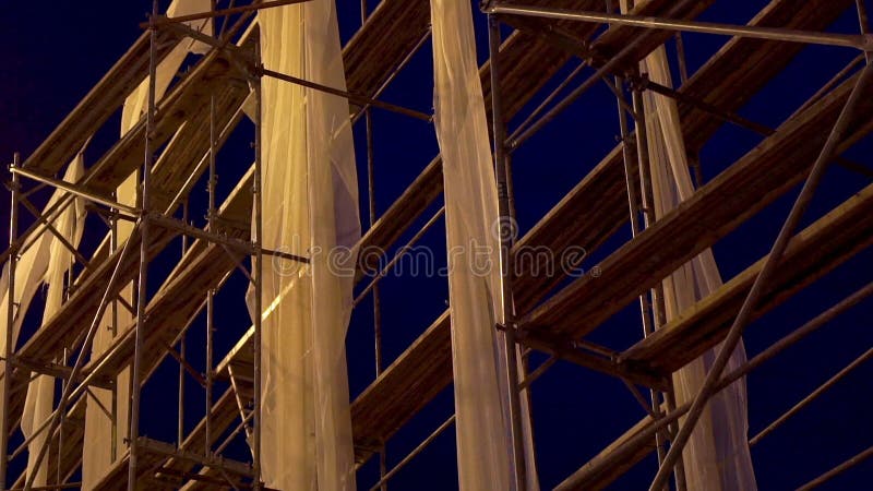 Camera Panning on Scaffold Construction. Night Scene Artificial ...