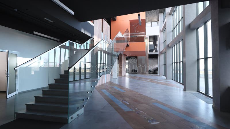 The Camera Pans Across a Spacious and Empty Hall Inside a Modern Office ...