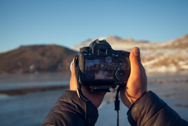 Camera in the Photographer Hand Stock Photo - Image of hand, equipment ...