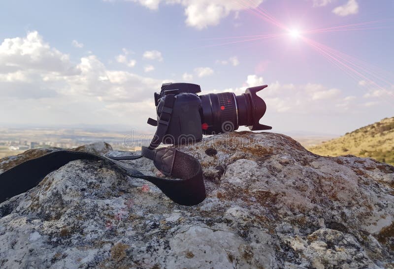 Camera Placed on a Mountain Stone in a Beautiful Landscape Stock Image ...
