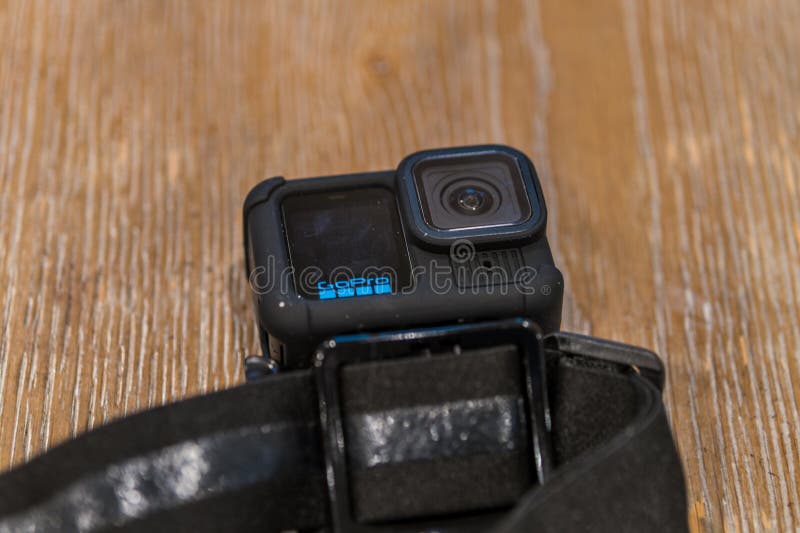 Camera Placed on Wooden Surface with Strap Attached during Indoor ...