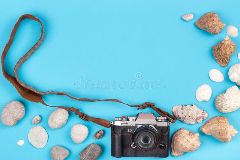 Camera and Seashells on a Blue Background.Background for the Traveler ...
