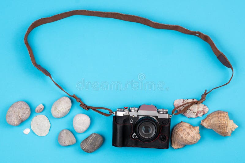 Camera and Seashells on a Blue Background.Background for the Traveler ...