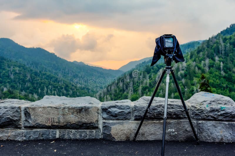 A Camera is Set Up on a Tripod in Front of a Mountain Stock Image ...