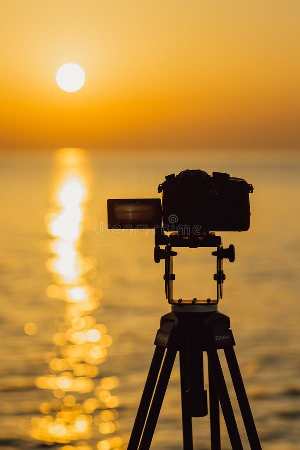 Capture the Sunset View with a DSLR Camera Standing on Standby Stock ...