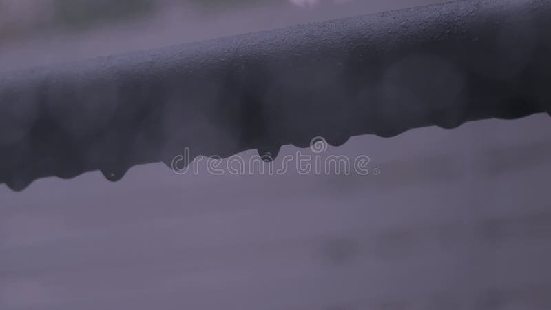 Camera Static through a Window on Raindrop Sticks on a Clothes Rack and ...