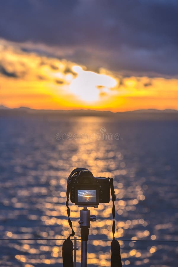 Camera on a Tripod Capturing the Sunset Stock Image - Image of gadget ...