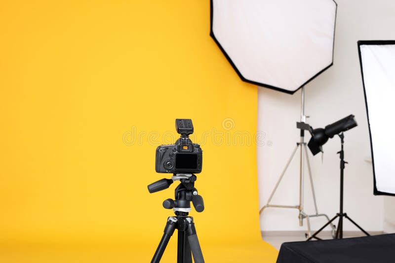 Camera on Tripod and Professional Lighting Equipment in Modern Photo ...