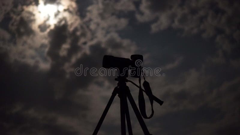 Camera on Tripod Under Night Cloudy Sky with Moon Stock Video - Video ...