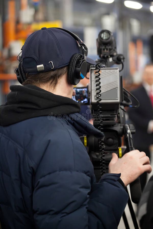 Professional Cameraman With Headphones Stock Photo - Image of live ...