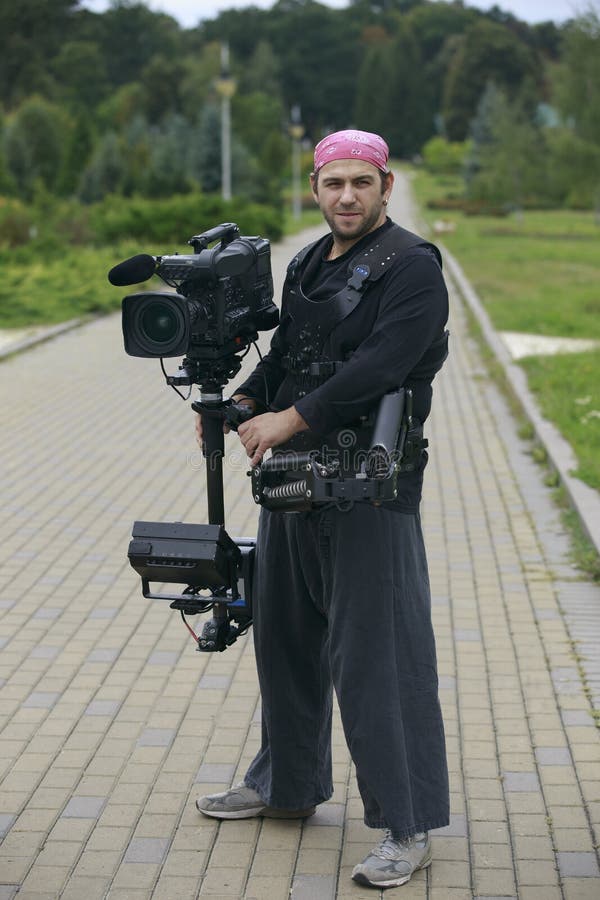 Cameraman in park stock photo. Image of wear, kerchief - 60204620