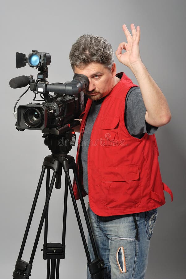 Cameraman in red vest stock photo. Image of cameraman - 14689498