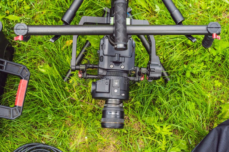 Cameraman Setting Up Heavy Duty Professional 3-axis Gimbal Stabilizer ... Cameraman Setting Up Heavy Duty Professional 3-axis Gimbal Stabilizer ...